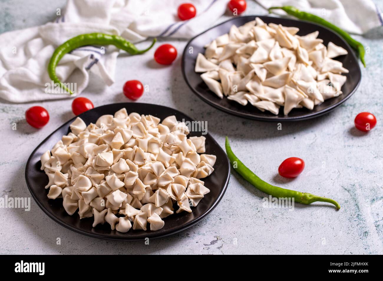 Frozen ravioli on stone floor. Stuffed ravioli in the middle. Turkish ...