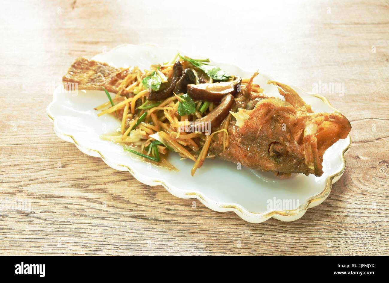 batter fried red grouper fish dressing ginger with mushroom in soy ...