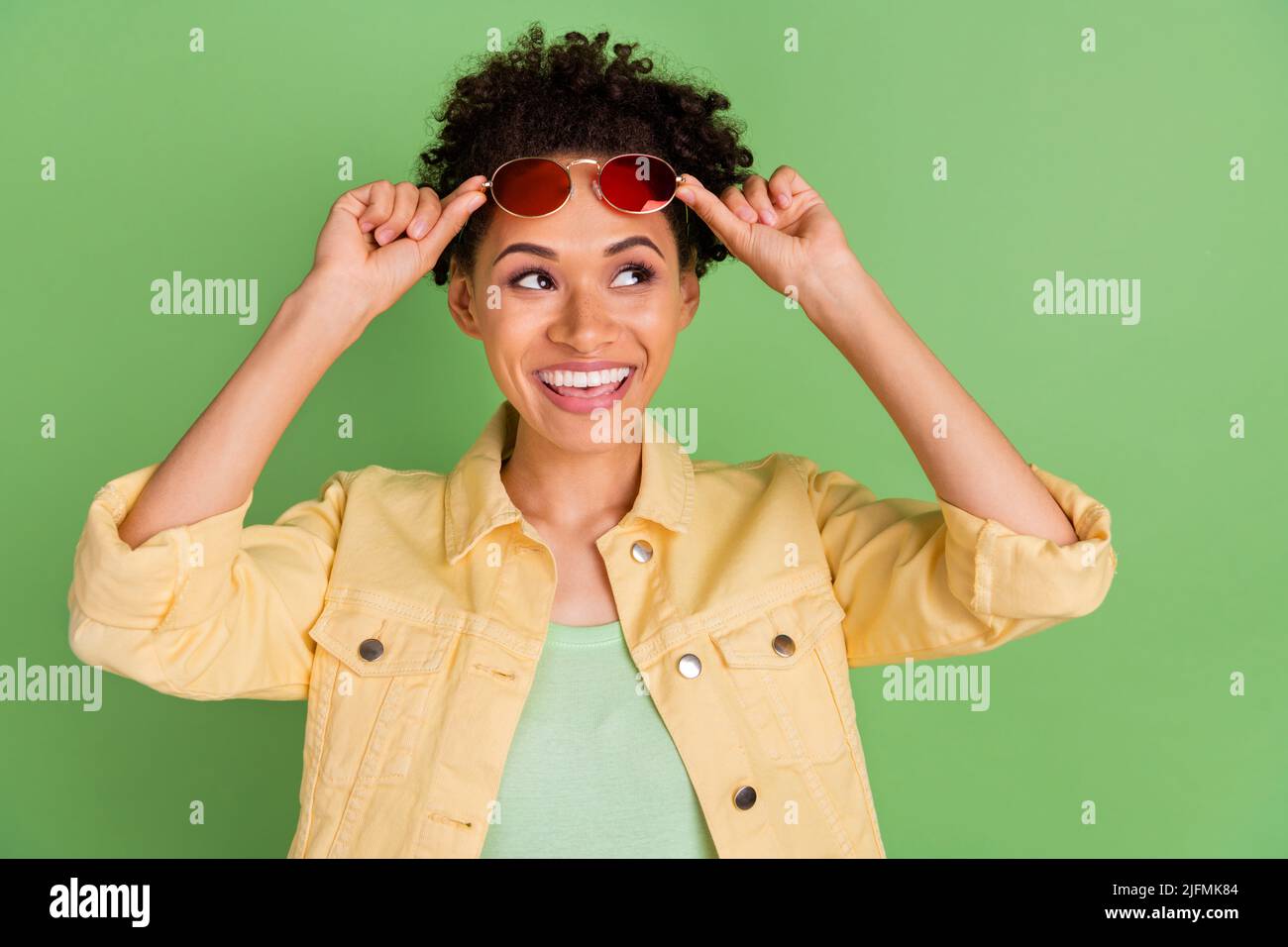 Photo of funny millennial brunette lady look empty space wear yellow ...