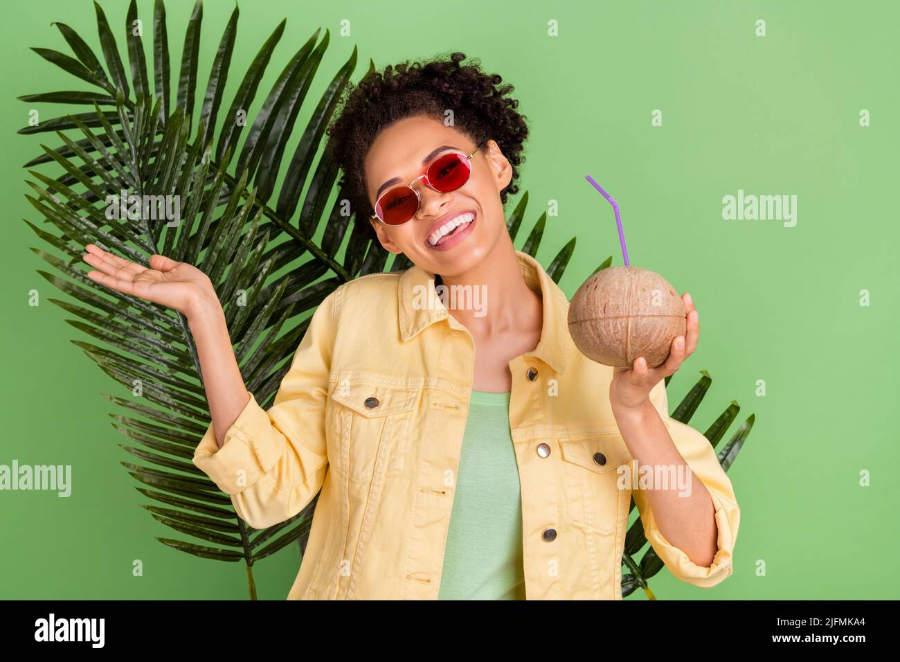 Photo of cute millennial brunette lady drink coconut wear eyewear ...