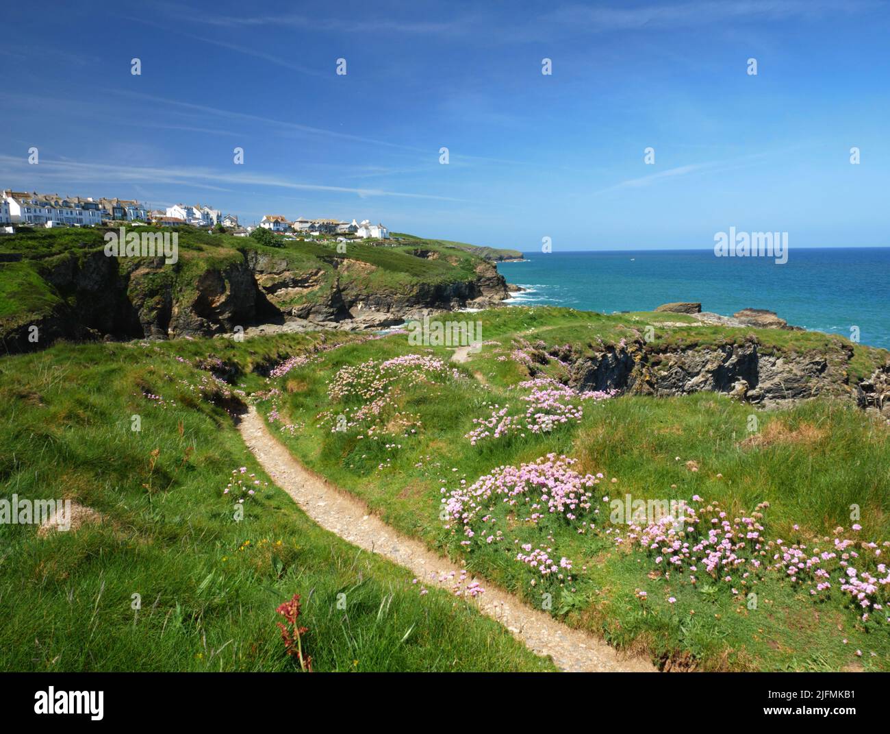 The cliff path near Port Gaverne, Cornwall, with Port Isaac in the ...