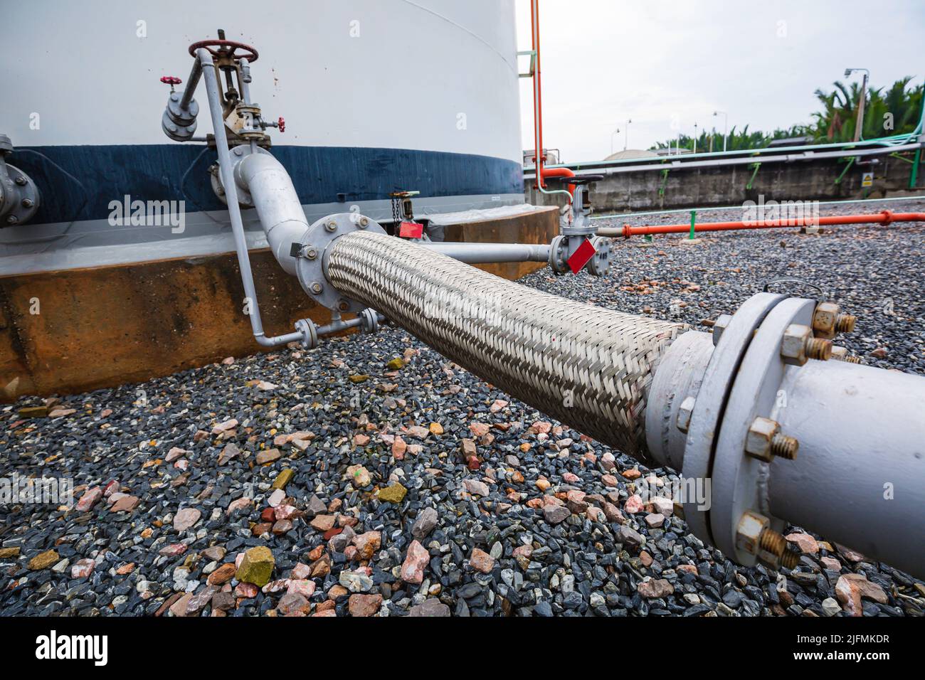 Pipe line flowing gray flange oil and bolt nut Stock Photo - Alamy