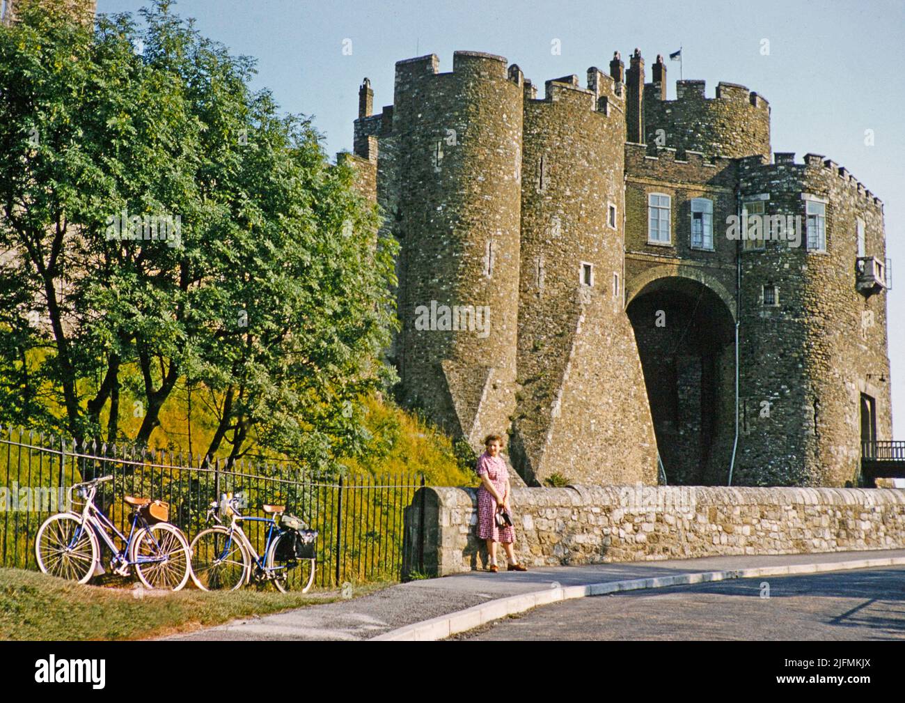 Woman standing near two bicycles at Constable's Tower, Dover Castle ...