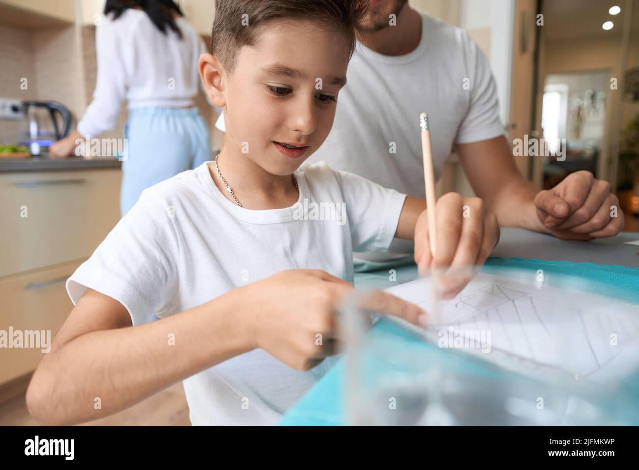 Careful schoolboy drawing in notepad while doing his classes Stock ...