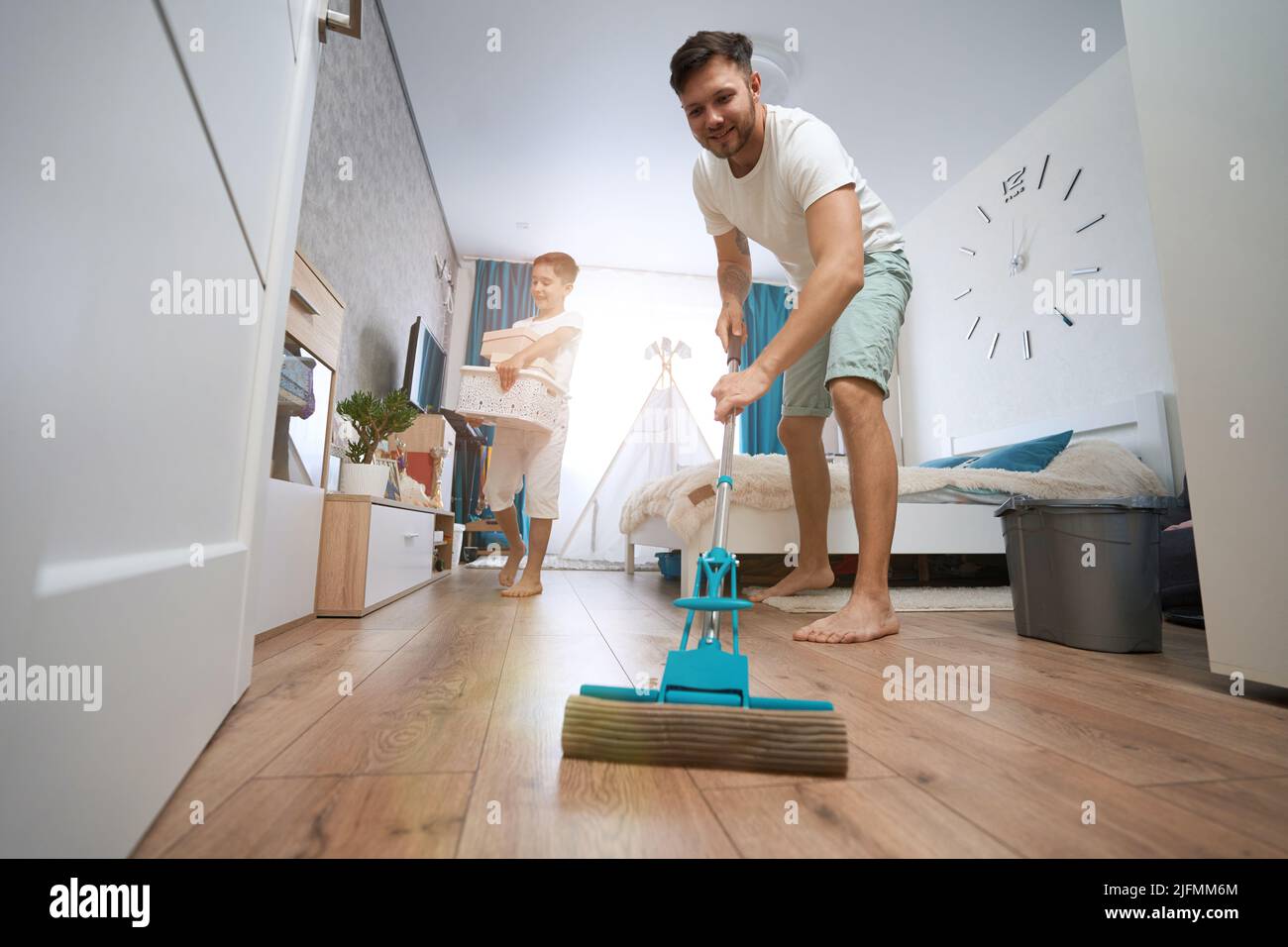 Boy cleaning bedroom hi-res stock photography and images - Alamy