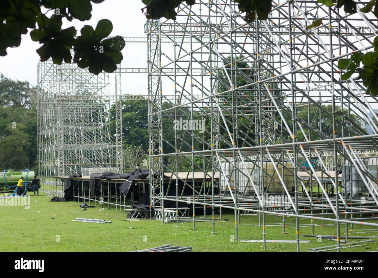 Different parts of metal scaffold on the construction field. Workers ...