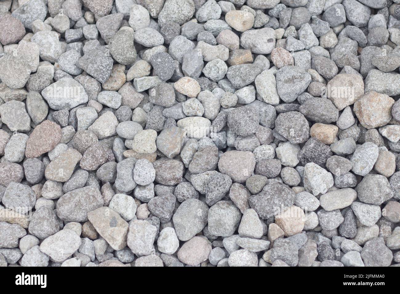 Gravel texture. Pebble stone background. Light grey closeup small rocks ...