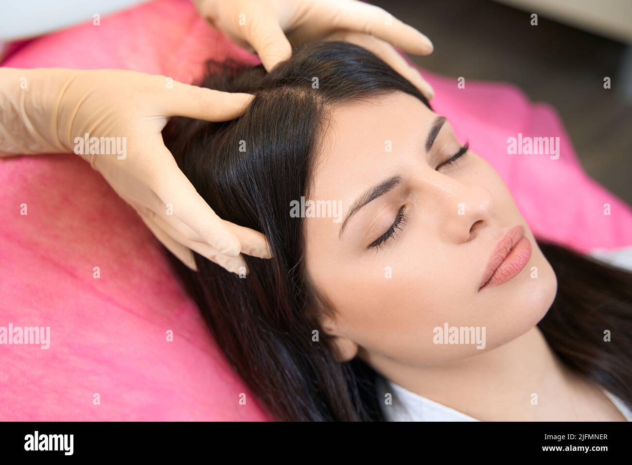 Head massage with hands after mesotherapy in medicine center Stock ...