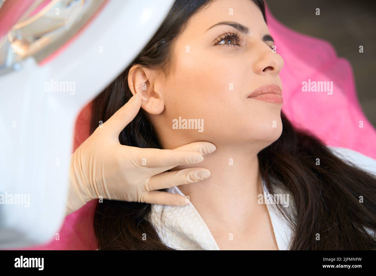 Doctor examines the patient skin under a magnifying glass Stock Photo ...
