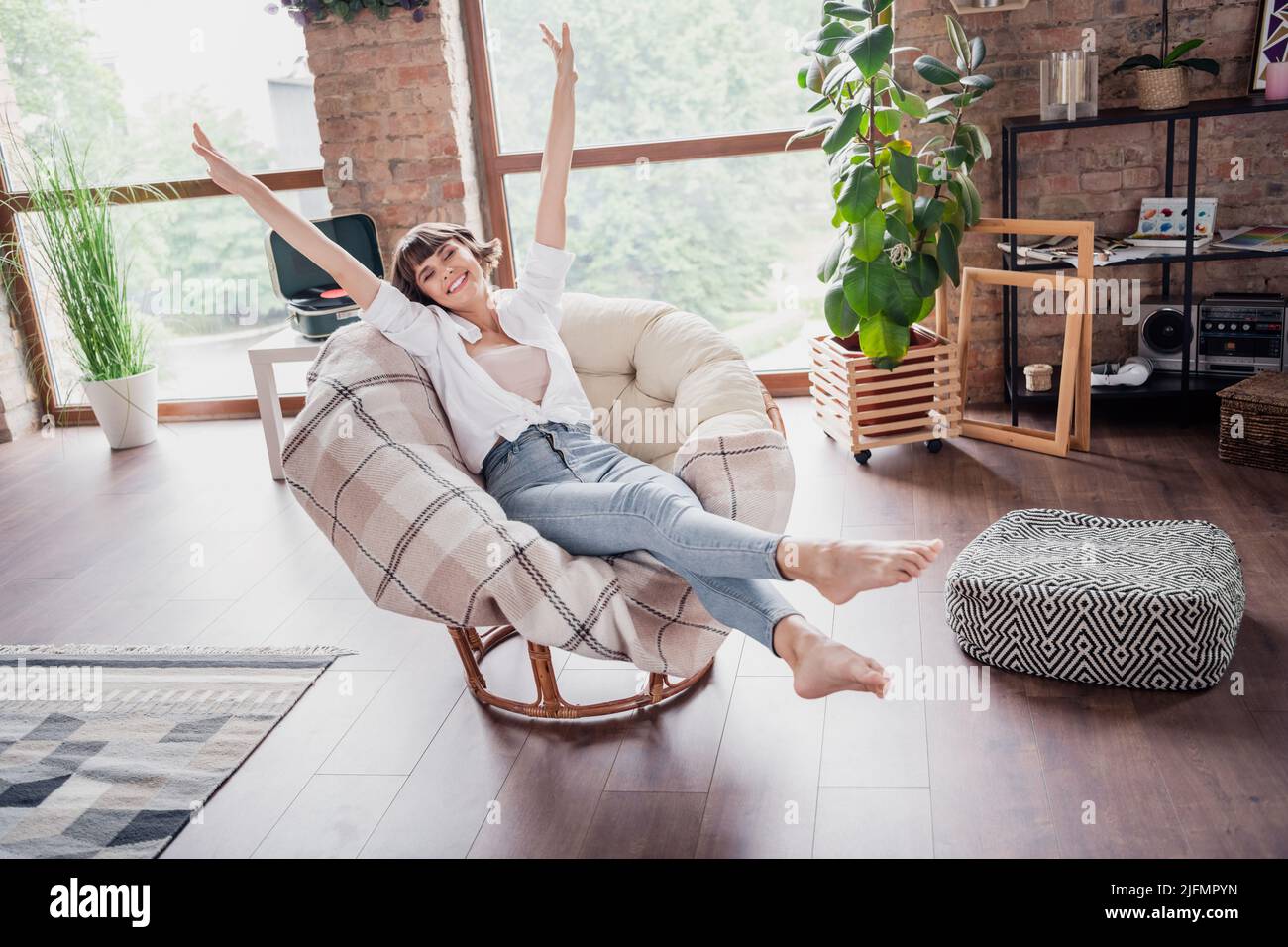 Full length body size photo woman sitting careless in armchair smiling ...