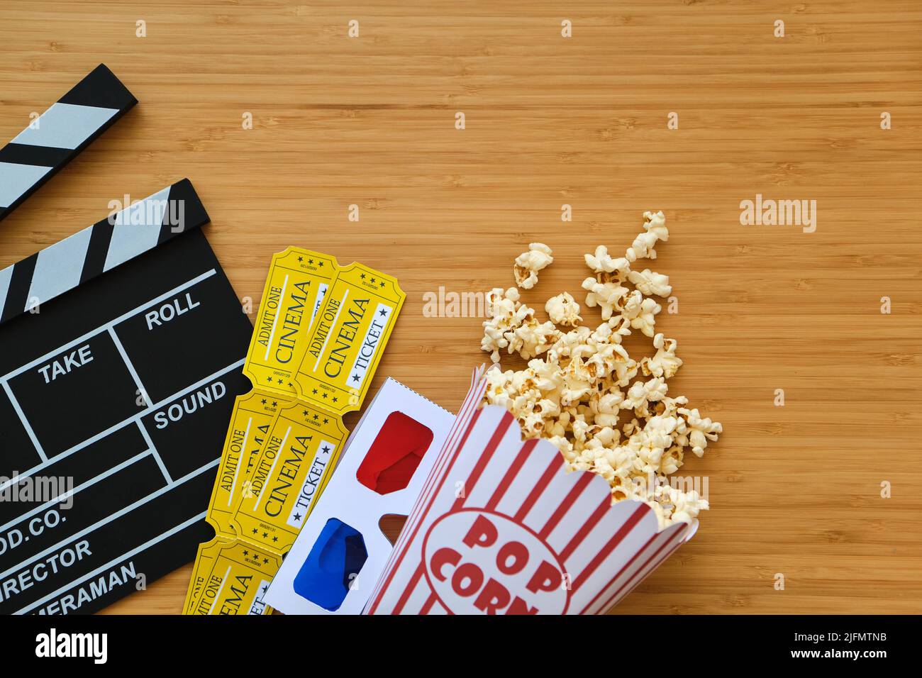 clapper board, movies tickets and popcorn Stock Photo - Alamy