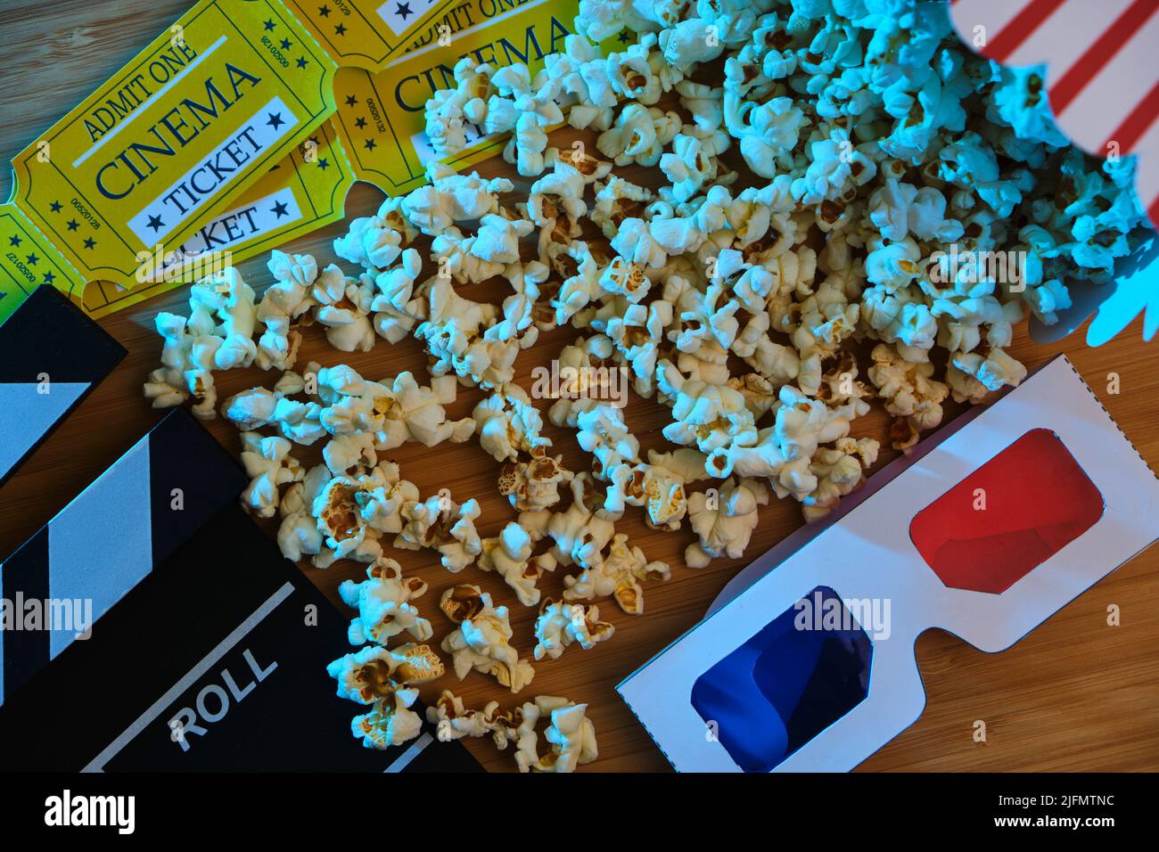 clapper board, movies tickets and popcorn Stock Photo - Alamy