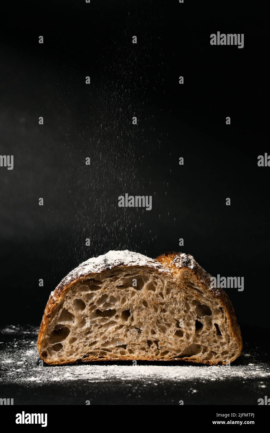 Sourdough sliced bread with big pores and falling flour Stock Photo - Alamy