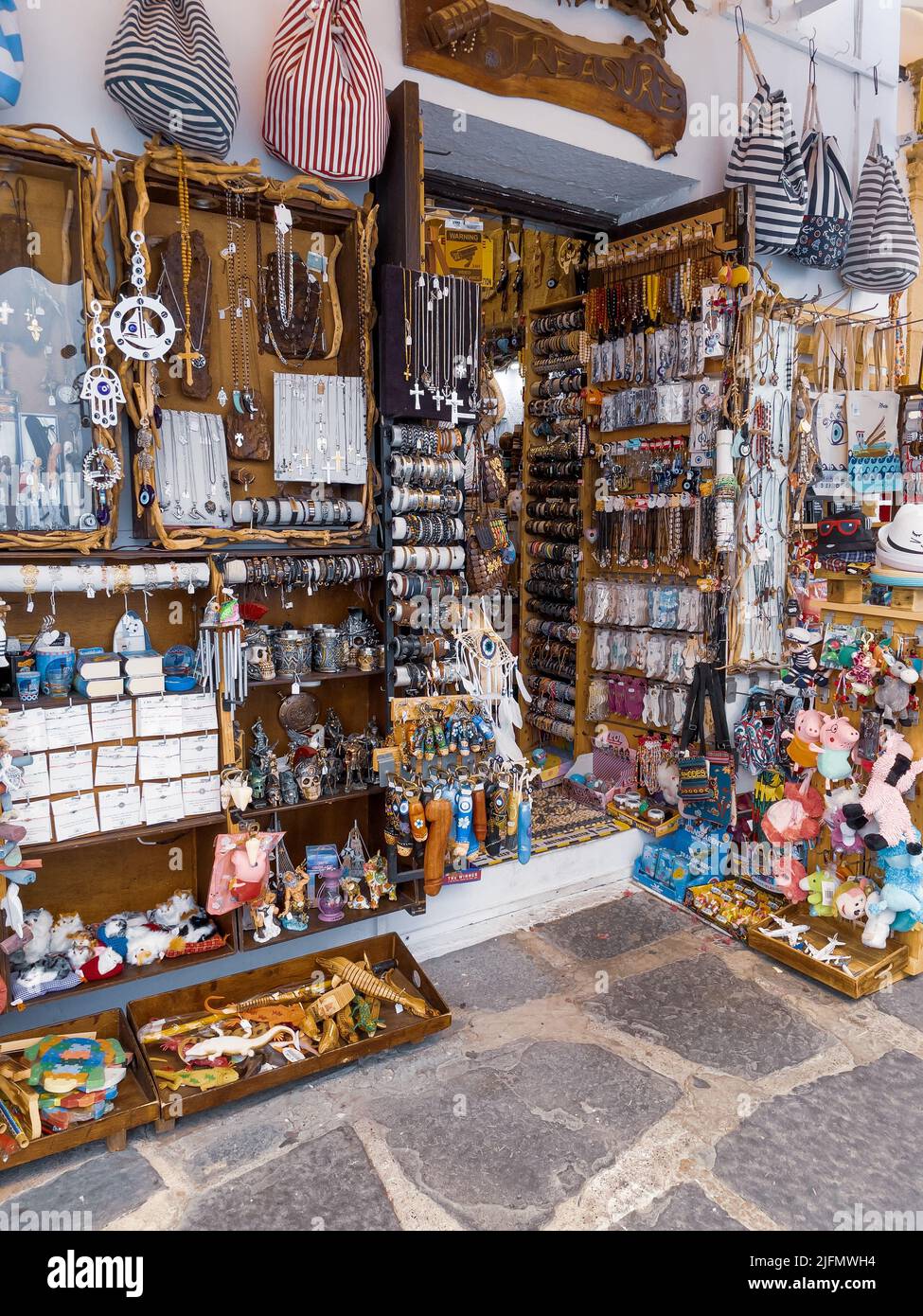 Lindos, Greece - 27 September, 2021. The souvenirs shops in old path of ...