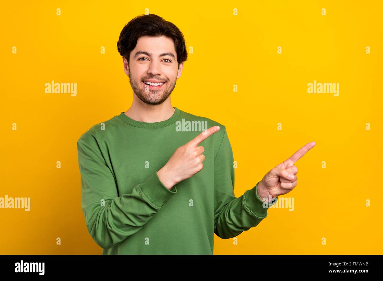 Photo of promoter guy direct finger empty space promo wear green ...