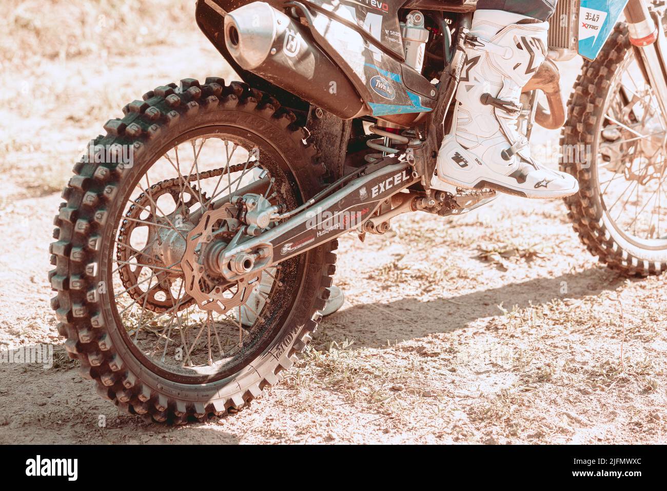 Close up motorcycle wheel on dust road, sand. Details. Motocross sport ...
