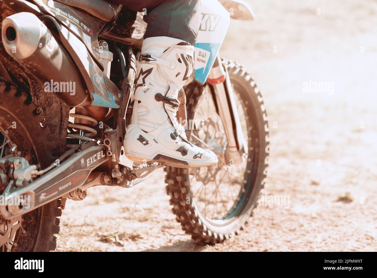 Close up motorcycle wheel on dust road, sand. Details. Motocross sport ...