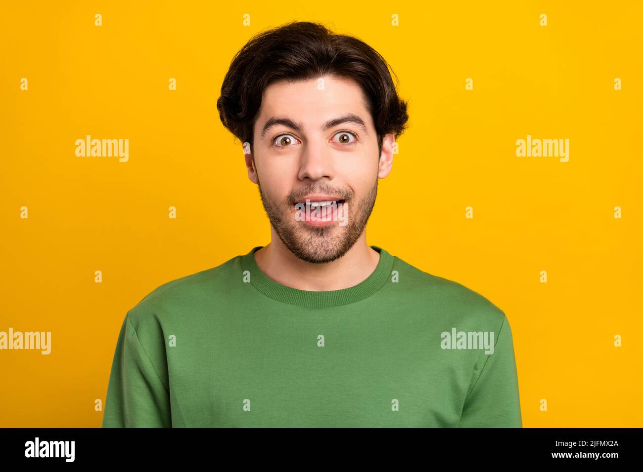 Photo of cheerful excited crazy guy open mouth omg reaction wear green ...