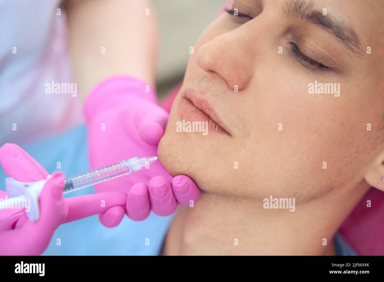 Young male doing filler injections in aesthetic clinic Stock Photo - Alamy