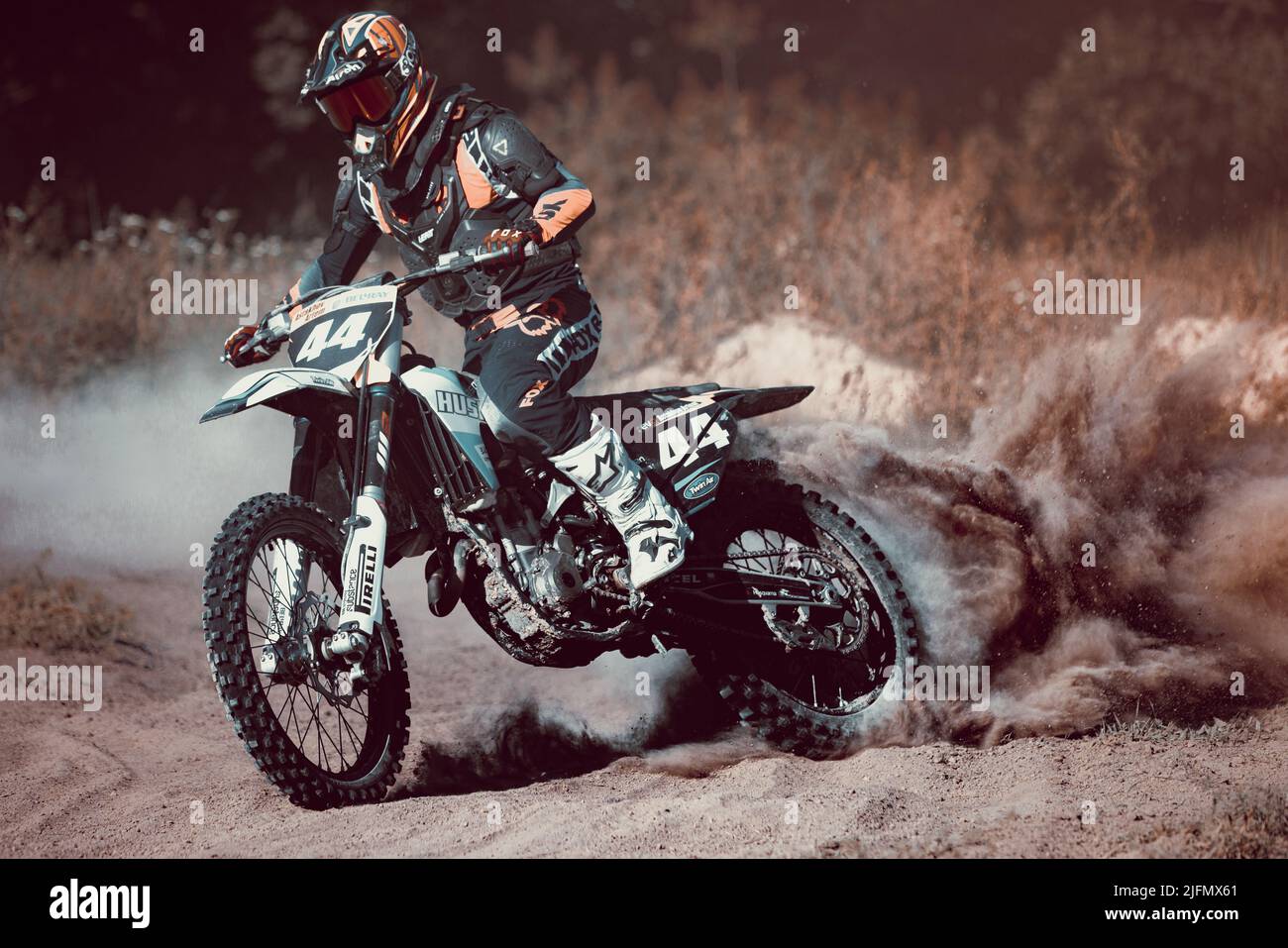 Forest trail, road. Live shot of professional motorcycle rider driving ...