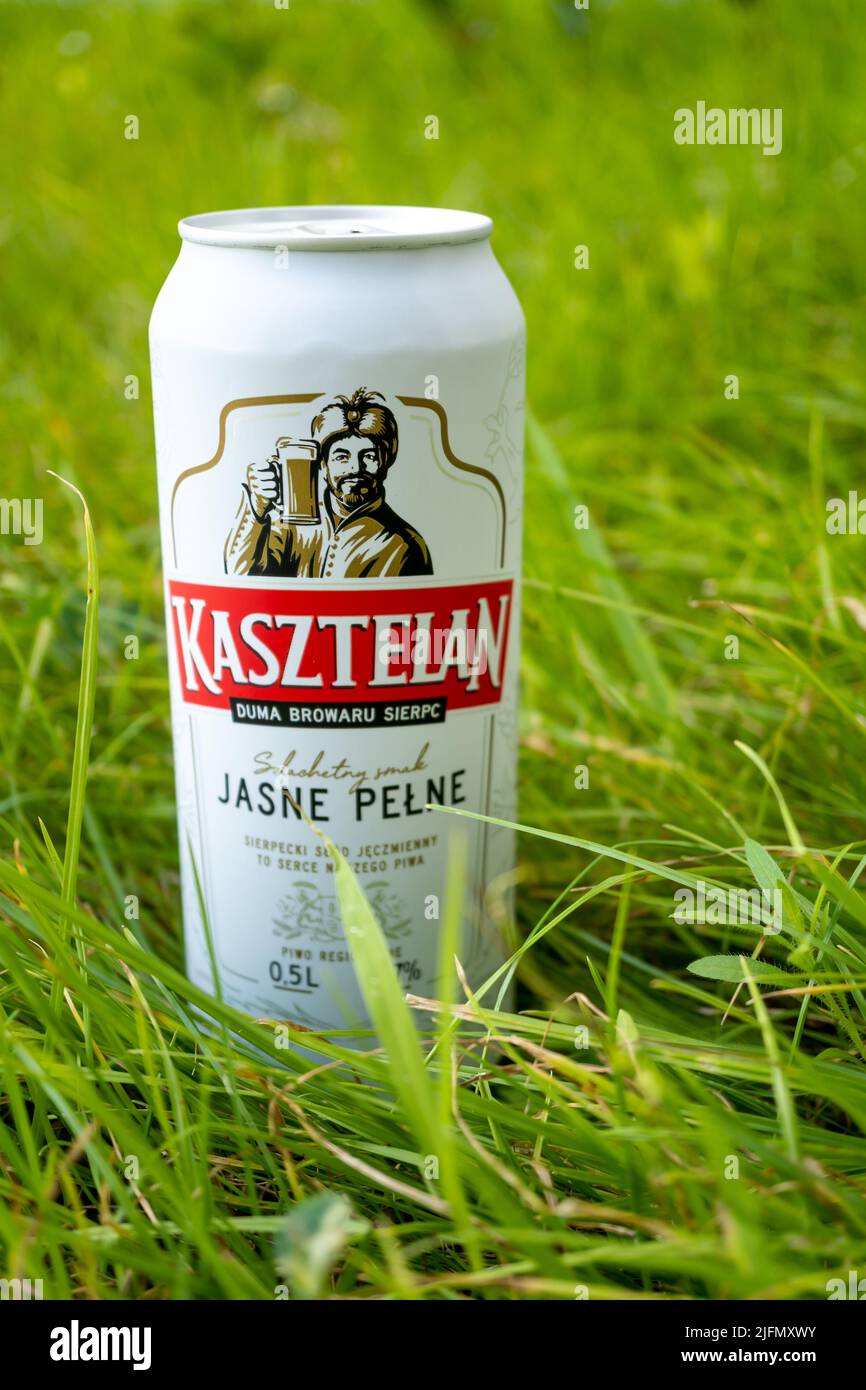 The Polish Kasztelan brand beer in a can on green grass Stock Photo - Alamy