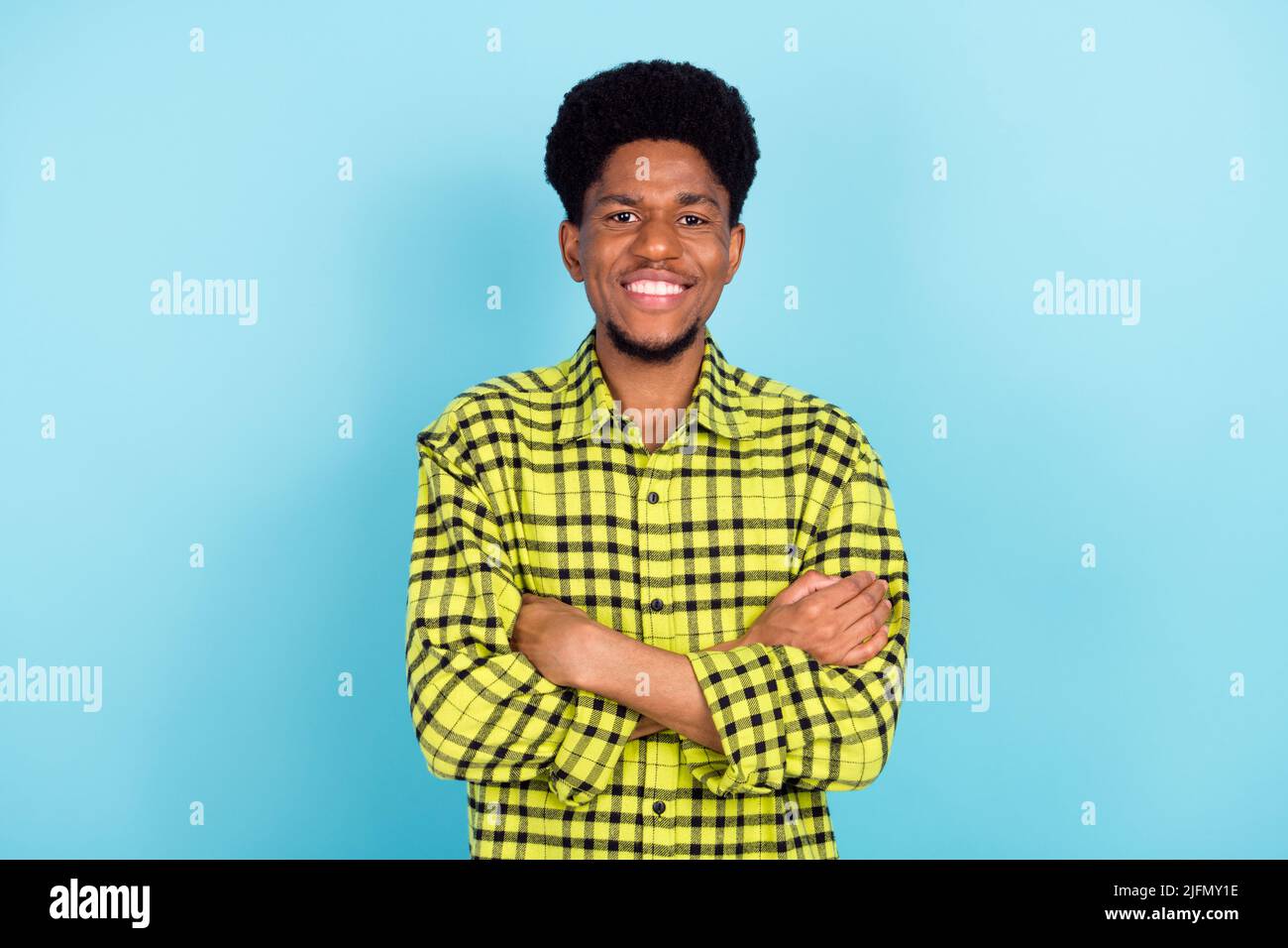 Photo of young positive confident afro american man hold hands crossed ...