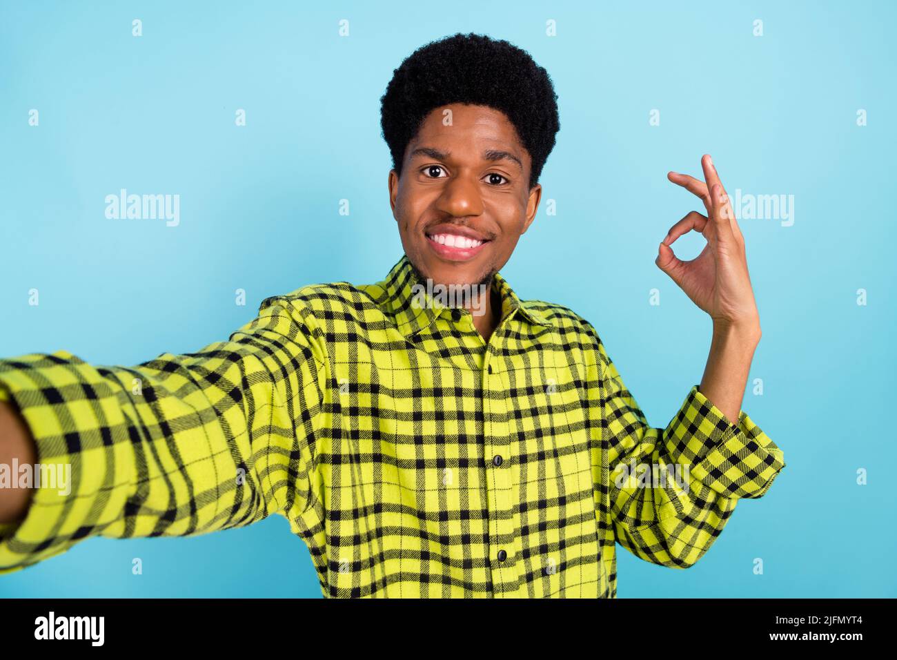 Photo of young brunette funky guy do selfie show okey sign wear yellow ...