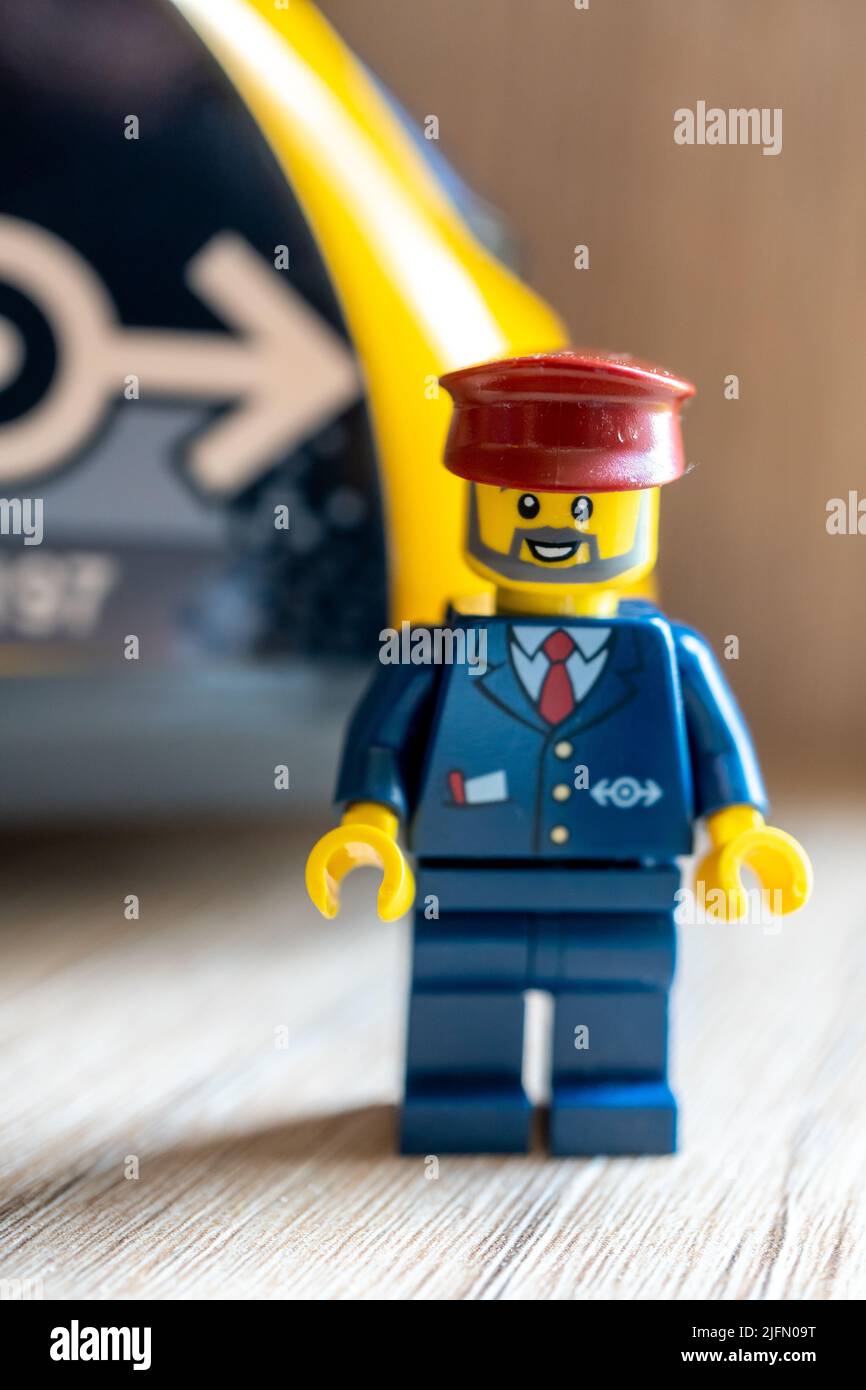 A Lego brand train conductor toy figurine with a beard and hat Stock ...