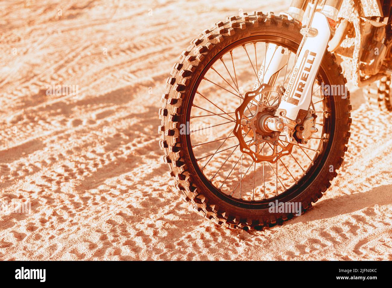 Close up motorcycle wheel on dust road, sand. Details. Motocross sport ...