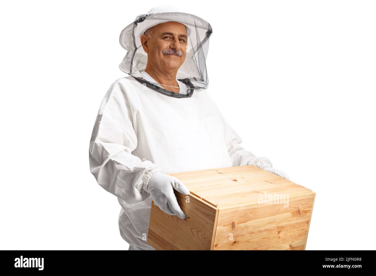 Male bee keeper holding a wooden box and smiling isolated on white ...