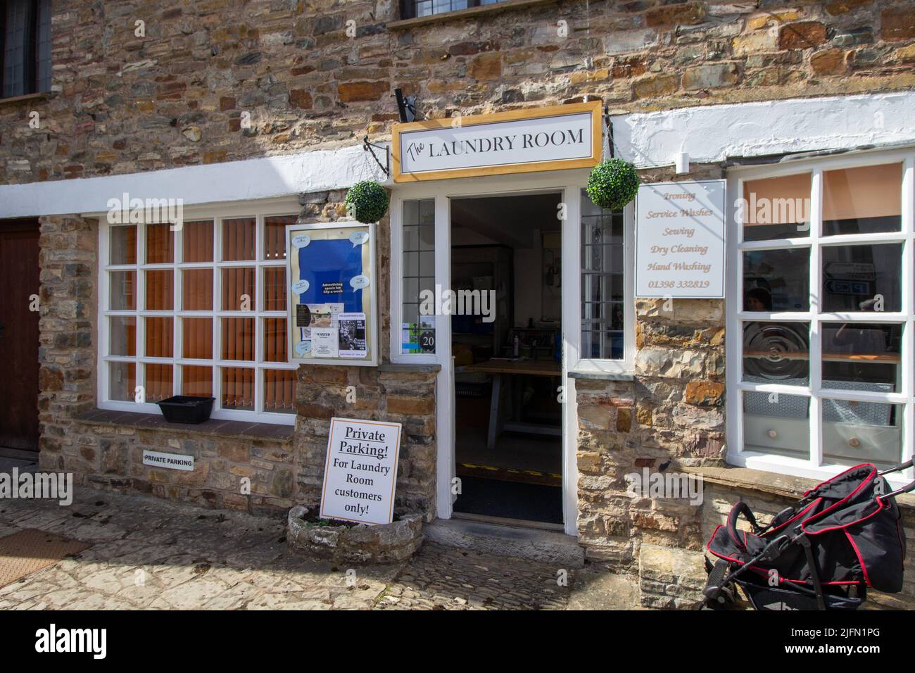 BAMPTON, DEVON, UK - APRIL 7, 2022 The Laundry Room on Fore Street ...
