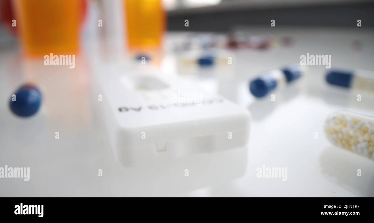Covid 19 test and capsules on the table, shallow focus Stock Photo - Alamy