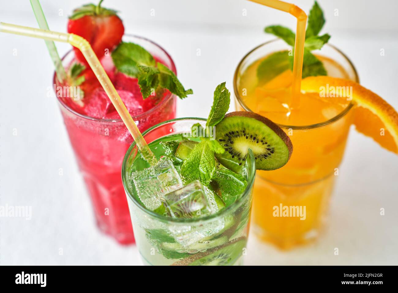 mix of three bright colored delicious cold lemonade Stock Photo - Alamy