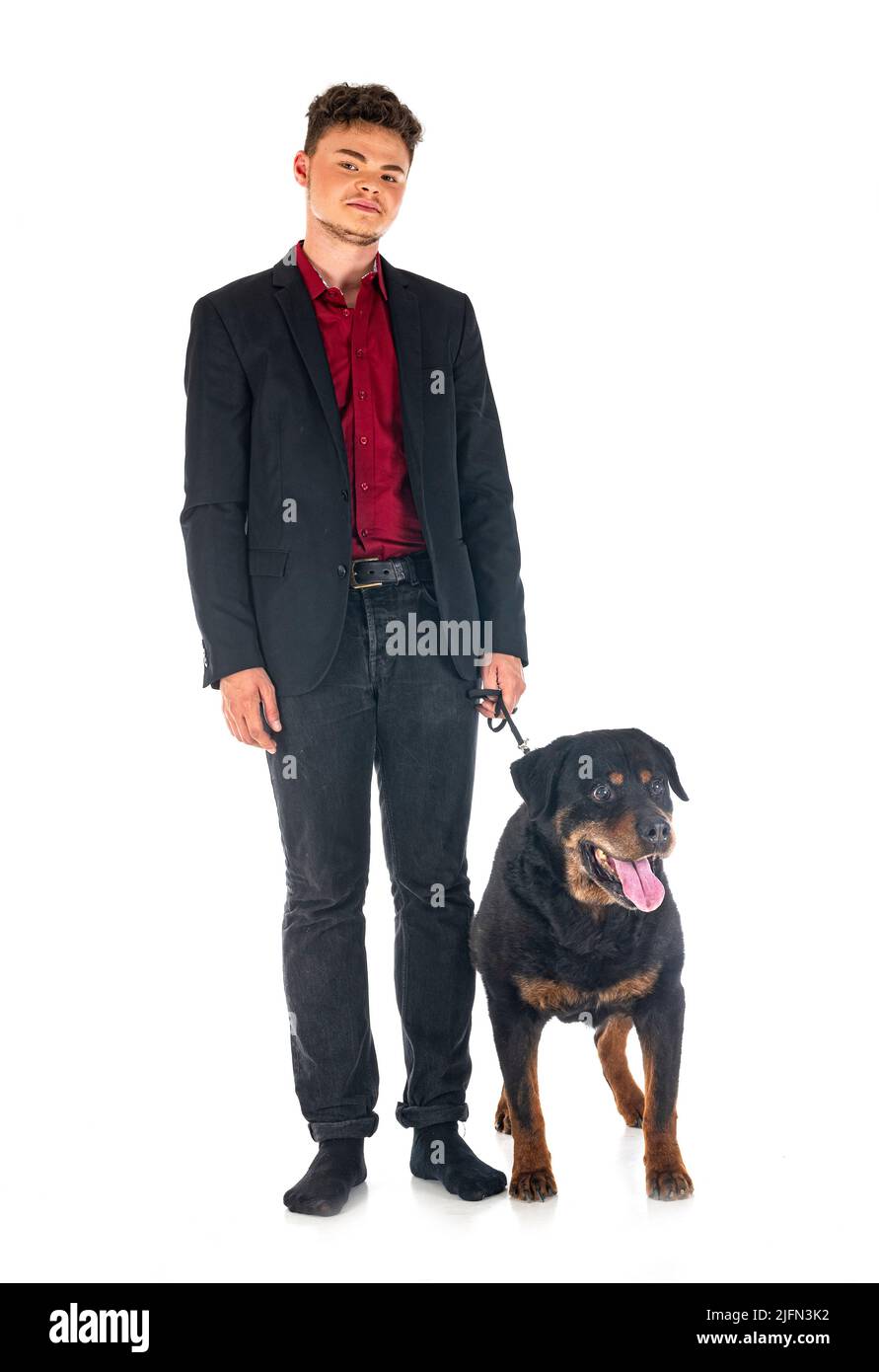 purebred old rottweiler fourteen year and his owner in front of white ...