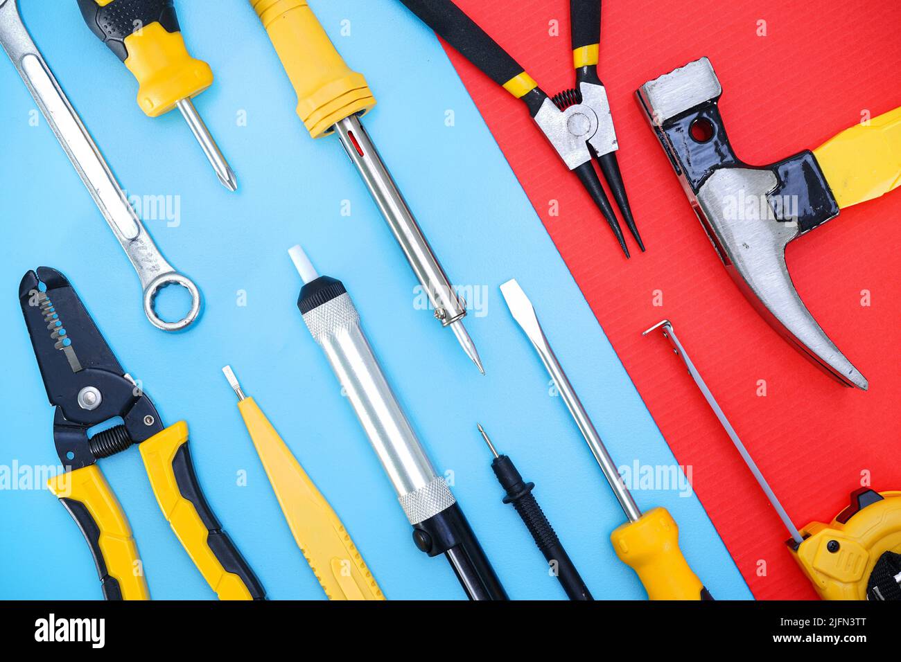 A group of tools isolated on blue-red background Stock Photo - Alamy