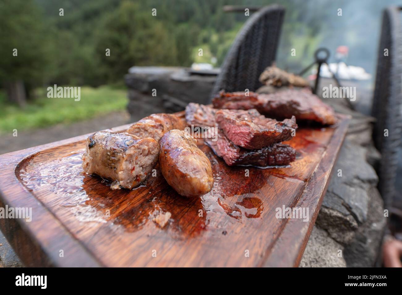 Typical Uruguayan and Argentine Asado Cooked on fire. Entrana and Vacio ...