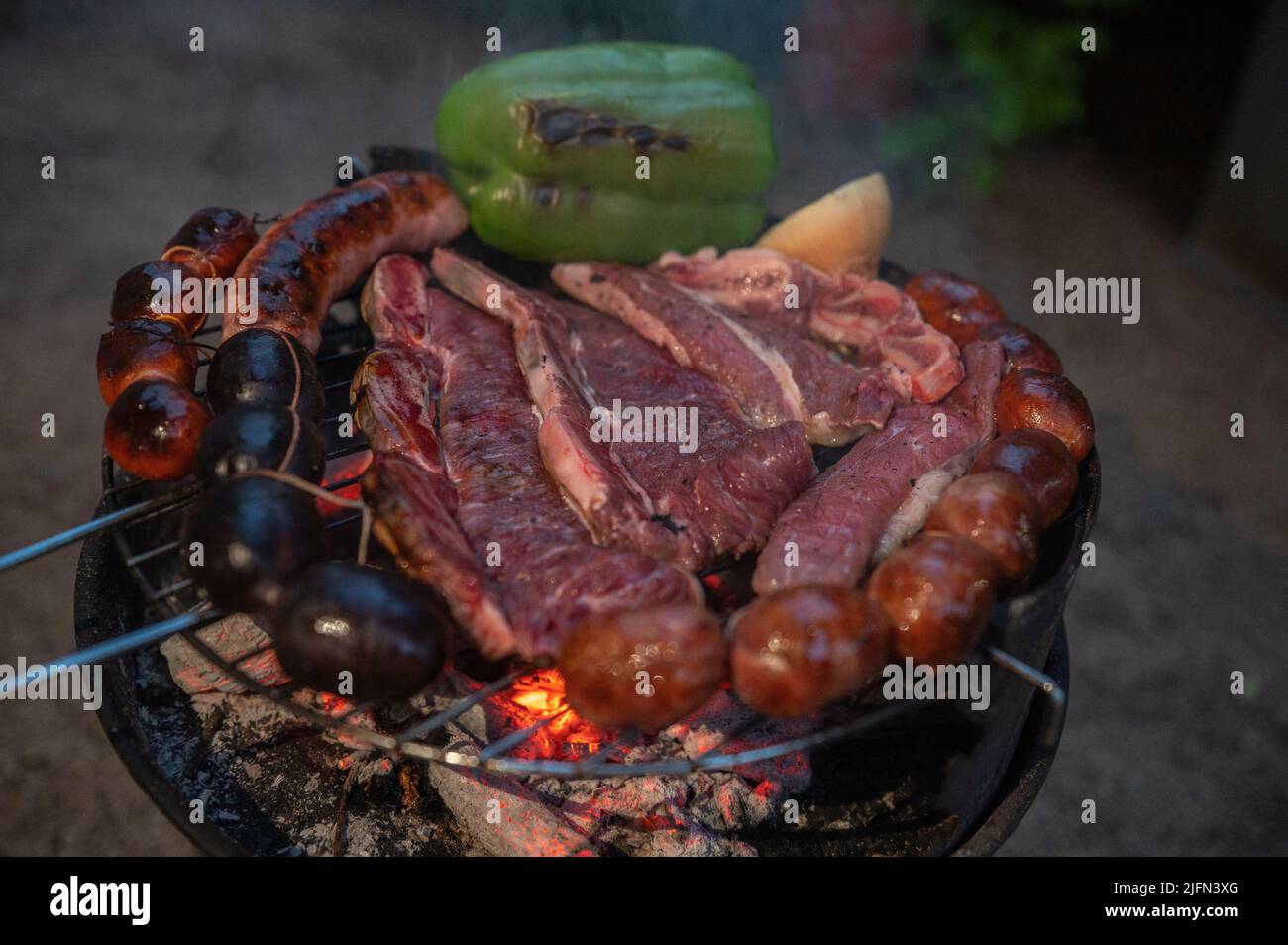 Typical Uruguayan and Argentine Asado Cooked on fire. Entrana and Vacio ...