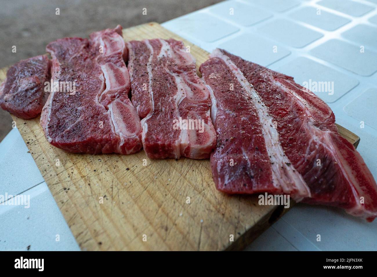 Typical Uruguayan and Argentine Asado Cooked on fire. Entrana and Vacio ...