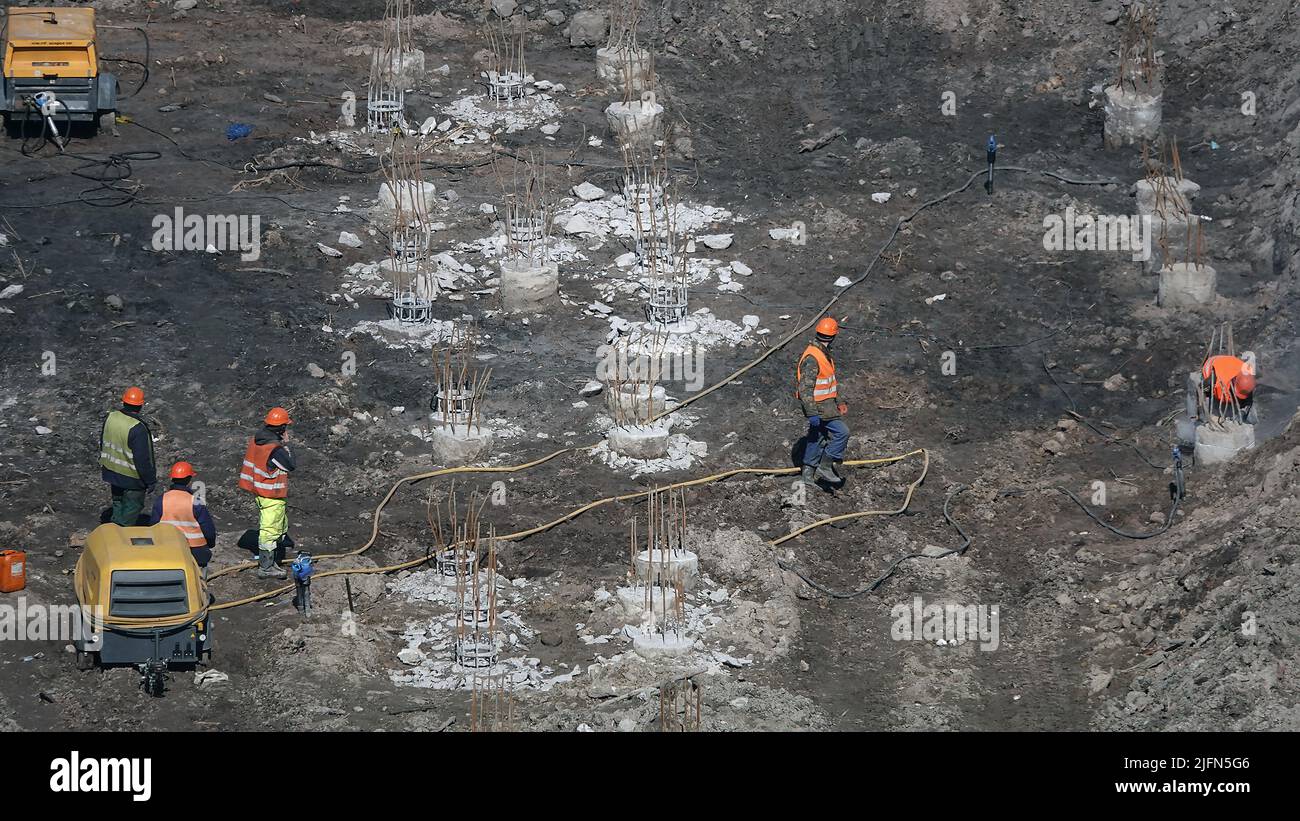 Kiev, Ukraine March 13, 2019: Workers and machinery - zero-cycle ...