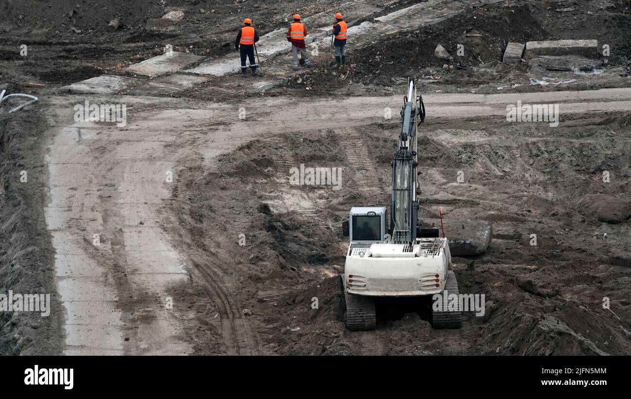 Kiev, Ukraine March 13, 2019: Workers and machinery - zero-cycle ...