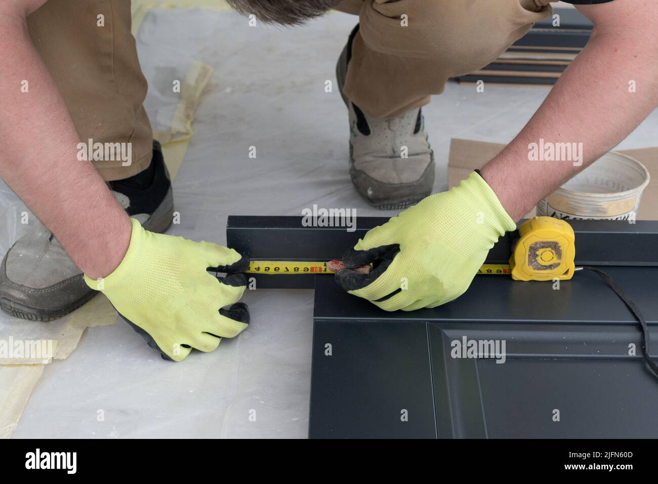 Measuring the length of the door leaf for subsequent installation, dark ...