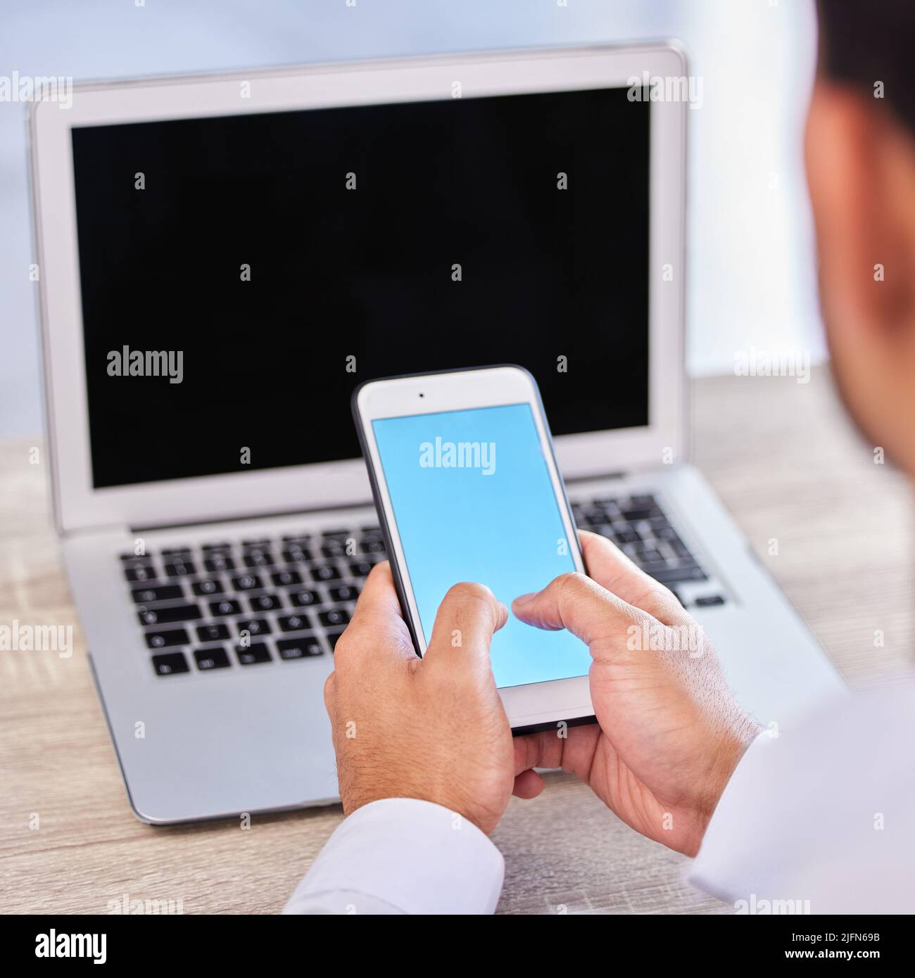 Closeup hand of businessman using smartphone. Businessman typing on ...