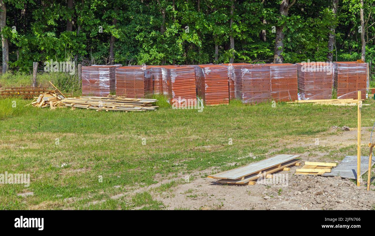 New Bricks Blocks at Pallets House Construction Site Stock Photo - Alamy