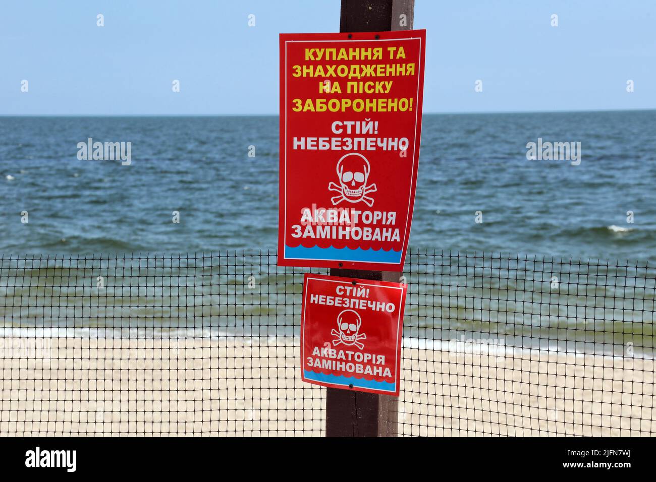 ODESA, UKRAINE - JUNE 4, 2022 - Warning signs caution against the ...