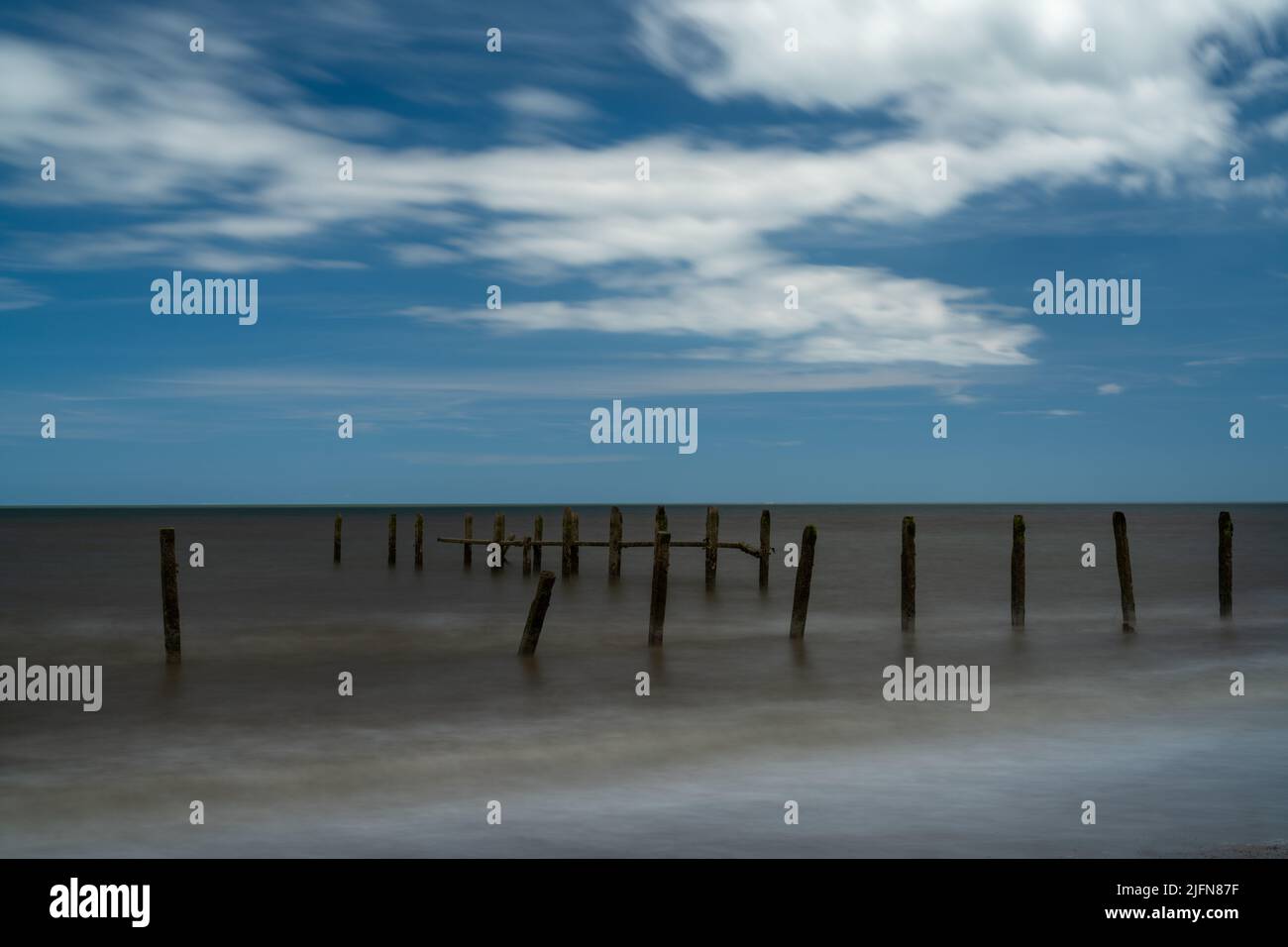 A long exposure view of old abandoned sea defenses on Happisburgh Beach ...