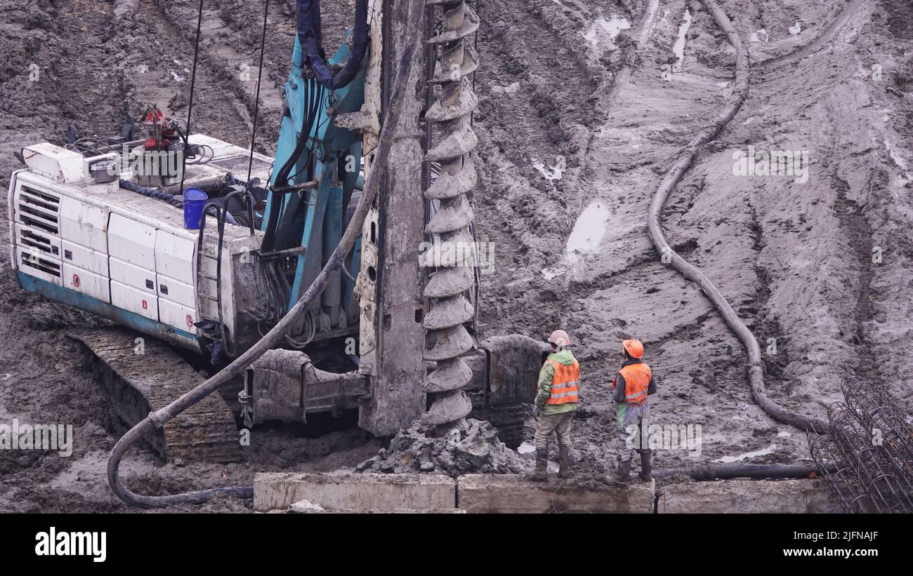 Kiev, Ukraine, October 17, 2018: Workers in the mud of a construction ...