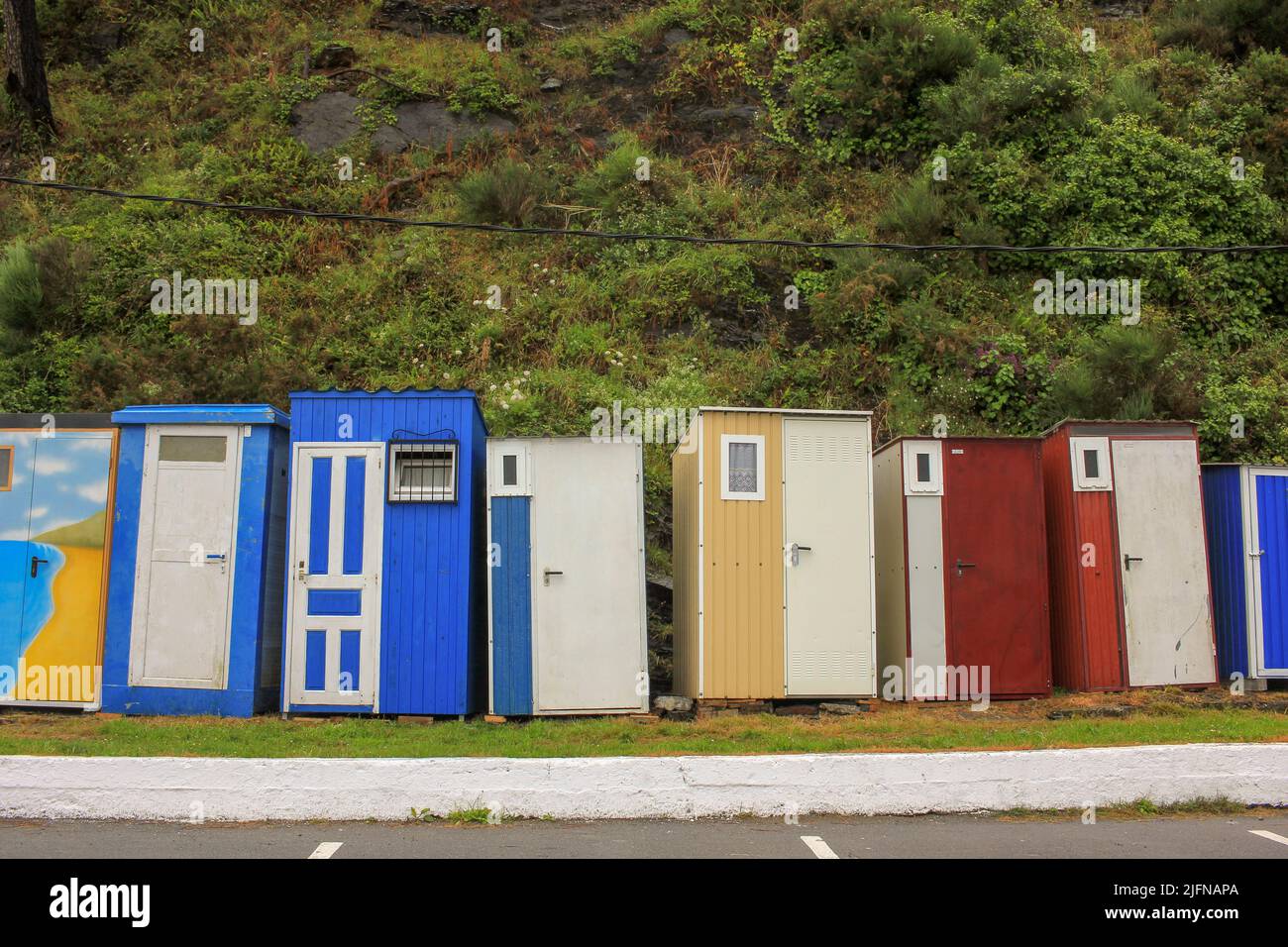 several huts in a row in front of a beach Stock Photo - Alamy