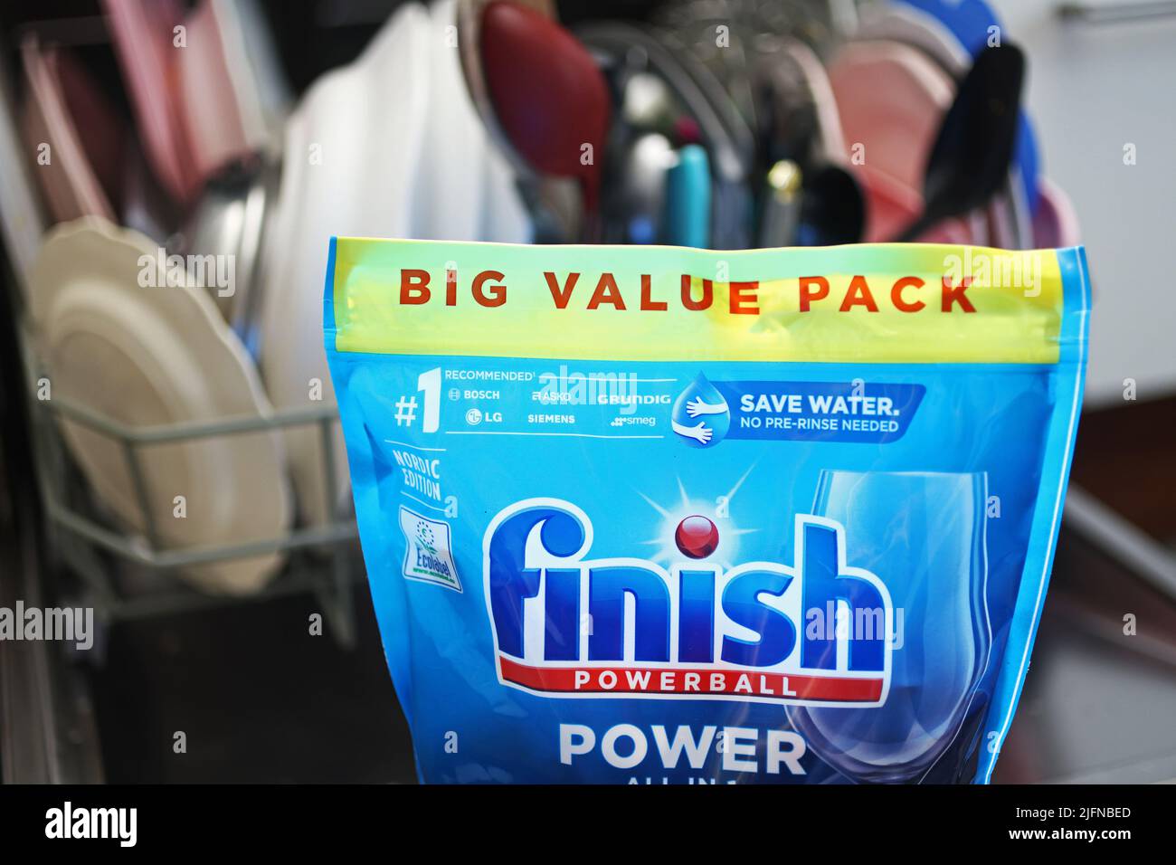Finish dishwasher detergent at a dishwasher in a kitchen in a home ...