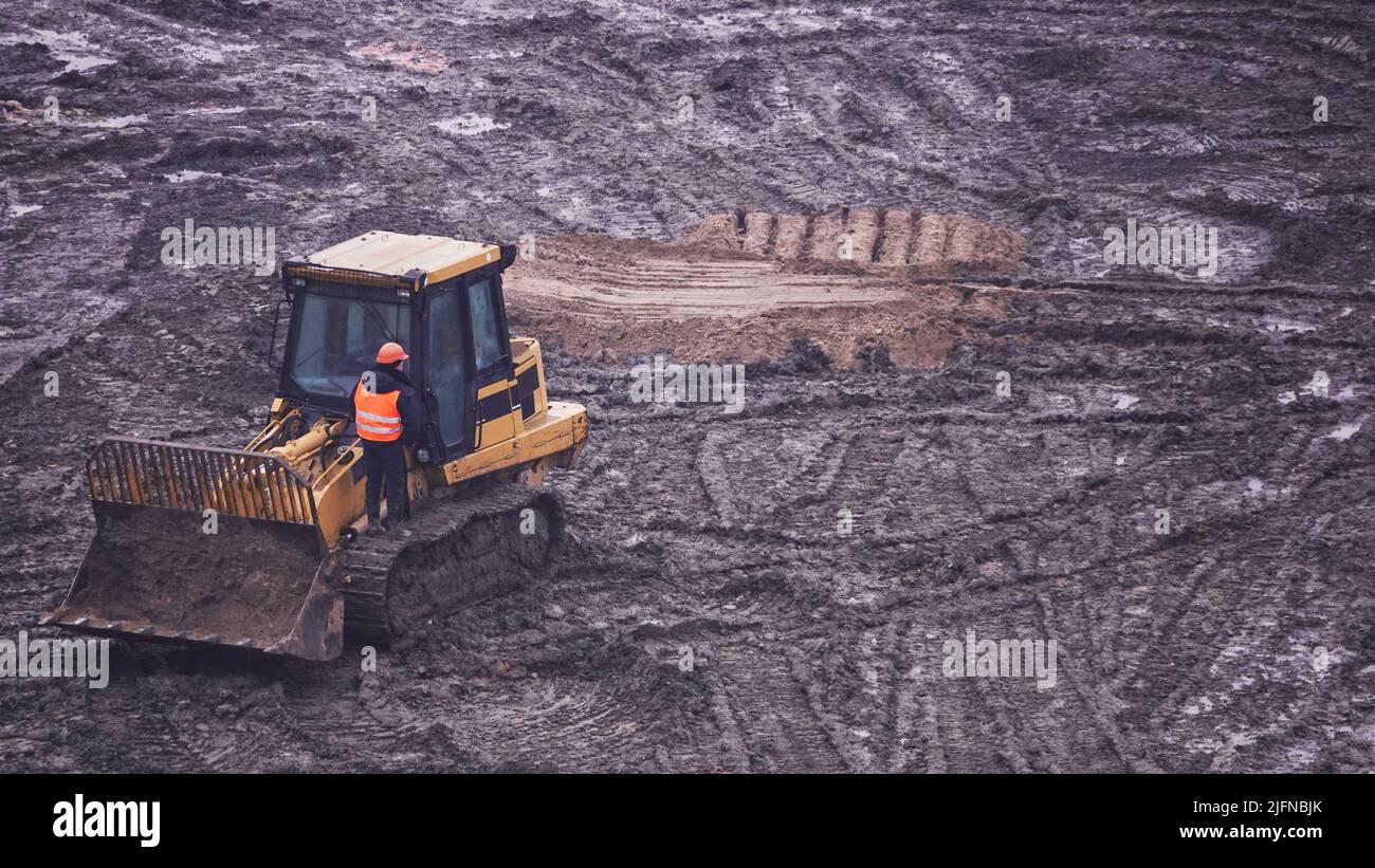 Kiev, Ukraine, October 17, 2018: Workers in the mud of a construction ...