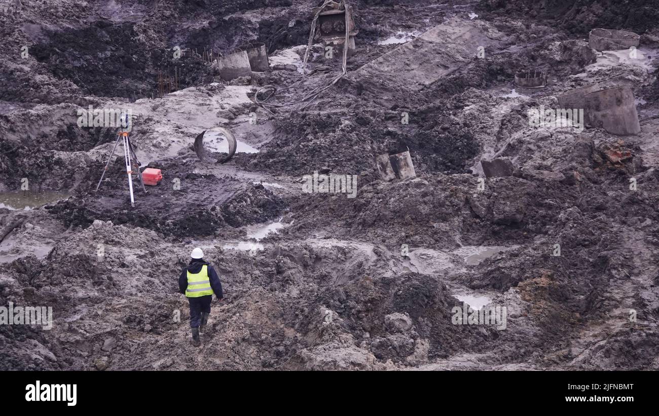 Kiev, Ukraine, October 17, 2018: Workers in the mud of a construction ...